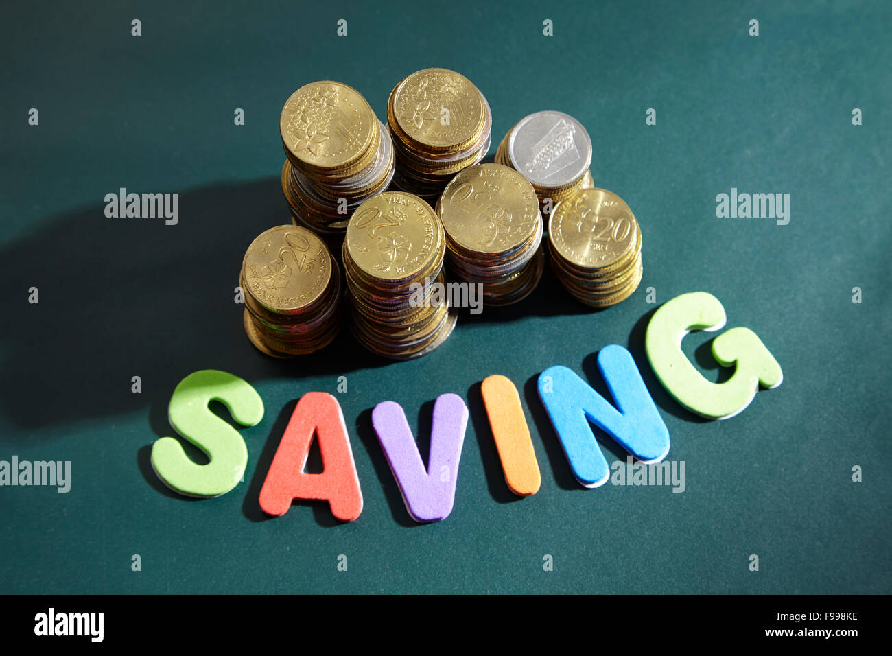 saving concept coin on the chalkboard Stock Photo - Alamy