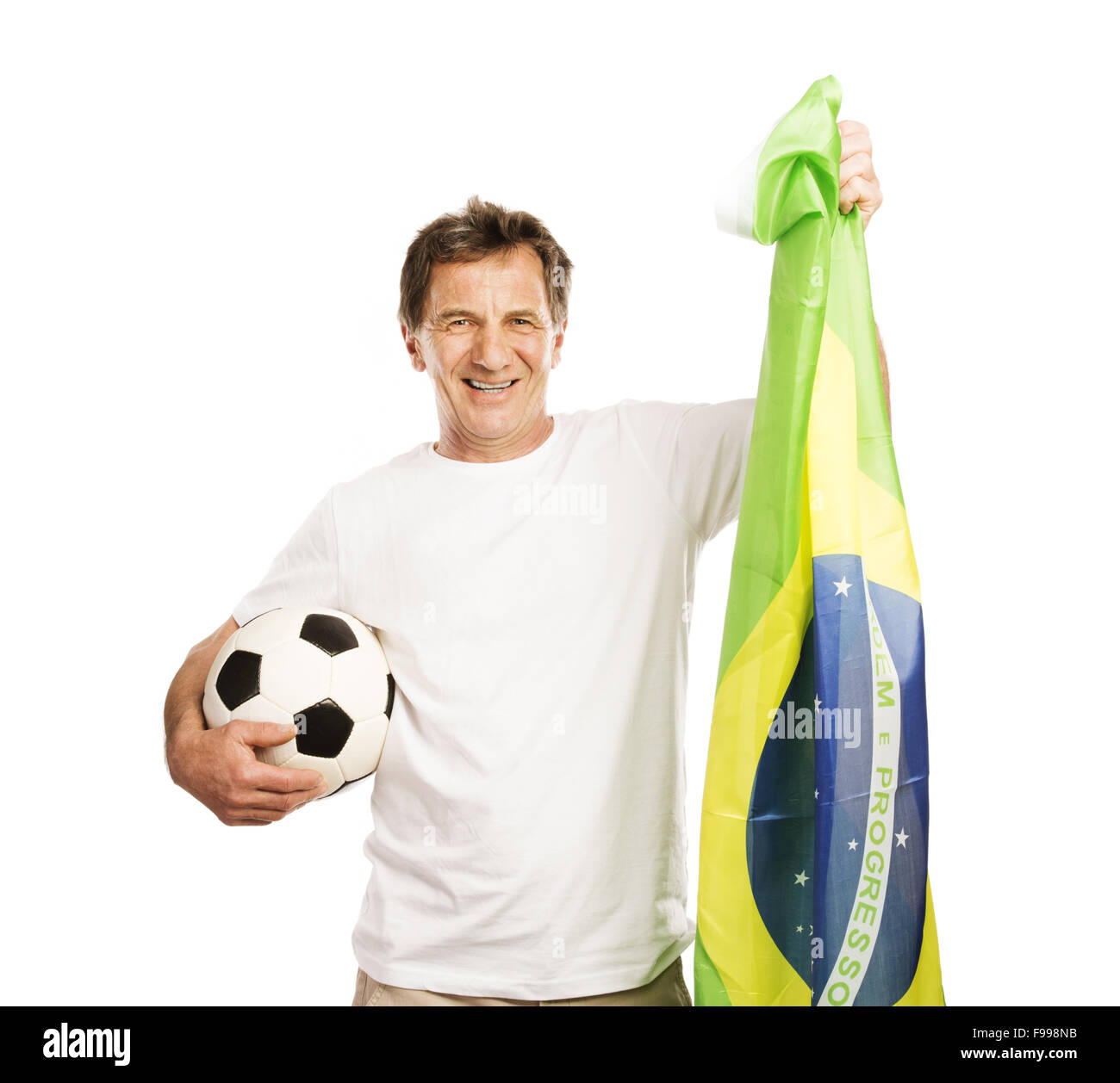 Brazilian senior soccer fan holding ball and flag of Brazil, isolated ...