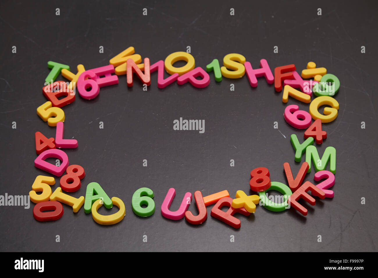Frame of plastic colorful alphabet letters on blackboard Stock Photo ...