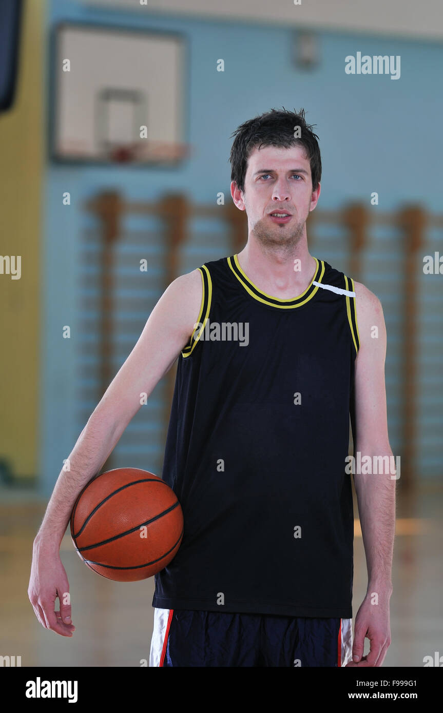 one healthy young man play basketball game in school gym indoor Stock ...