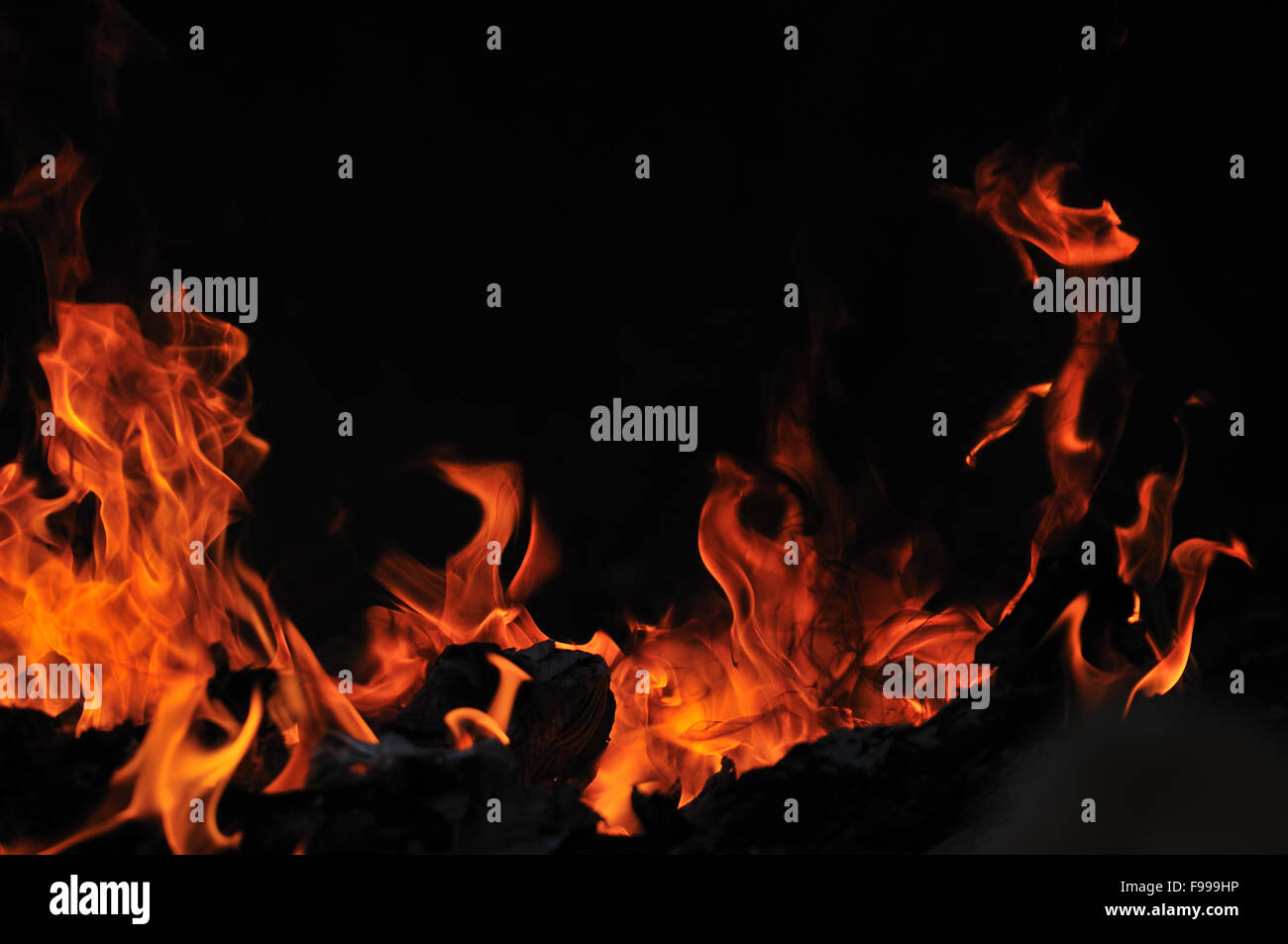 wild fire flames burn hot with black background Stock Photo - Alamy