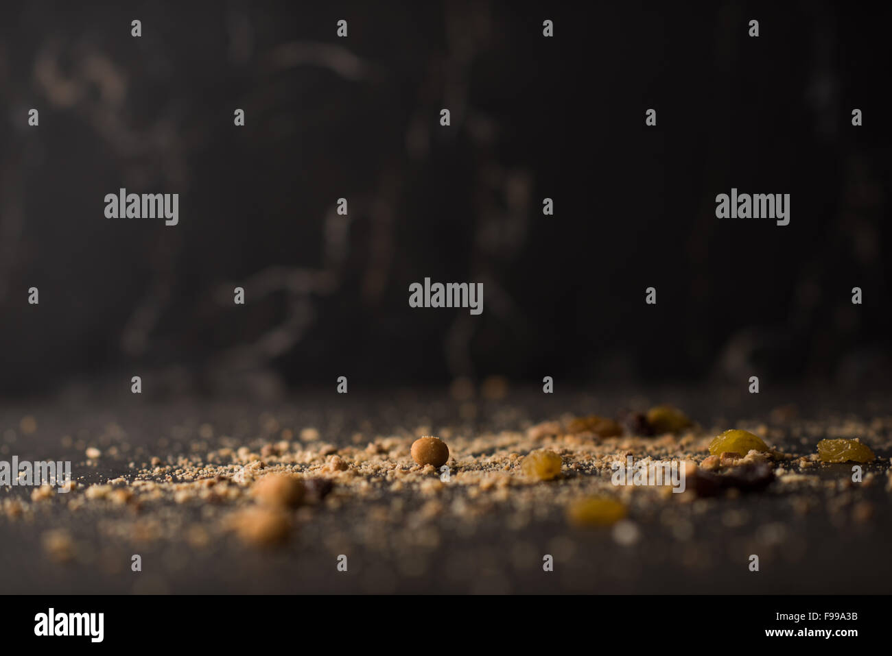 Crumbs on dark stone background Stock Photo - Alamy
