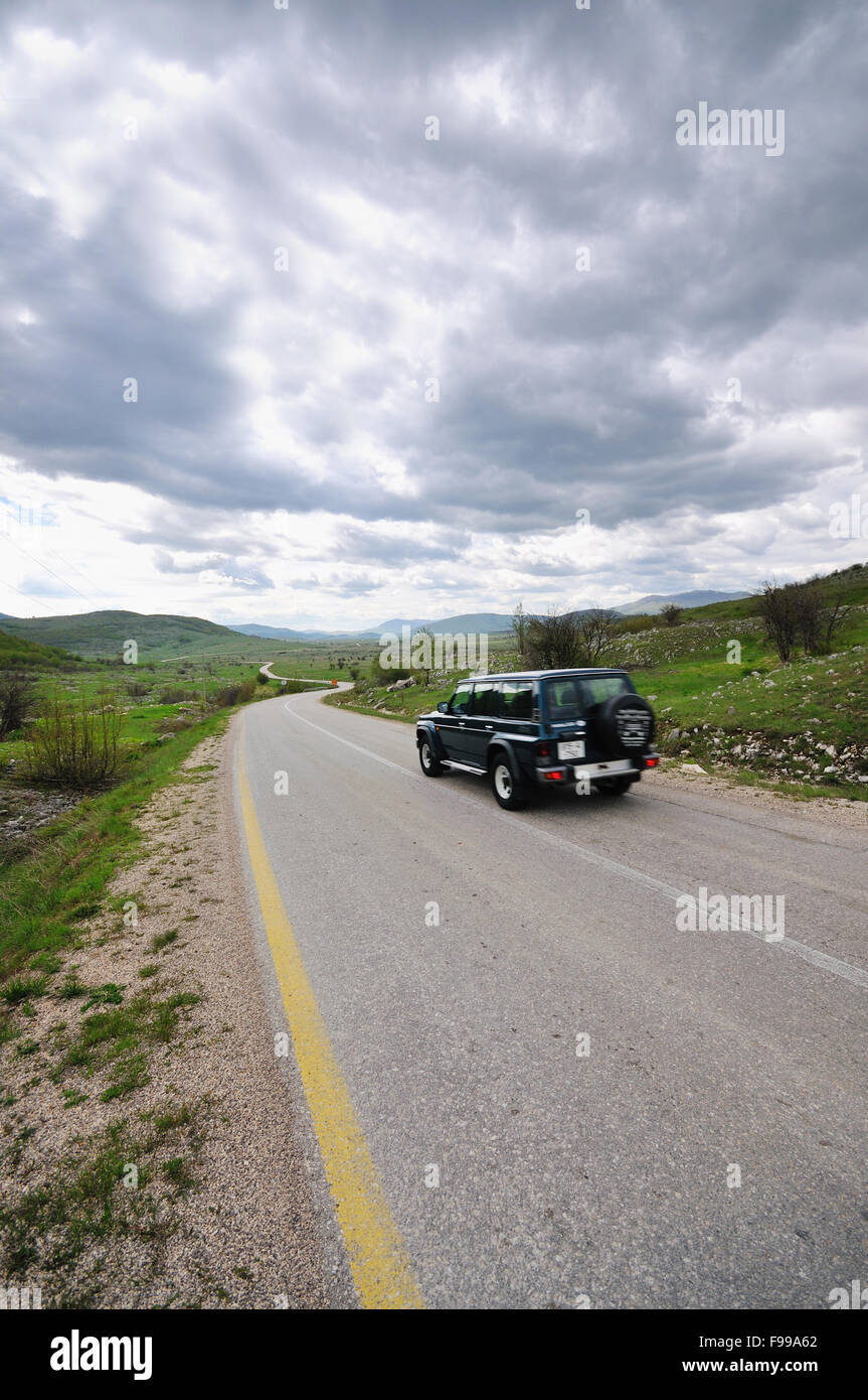 big truck drive on long country road Stock Photo - Alamy