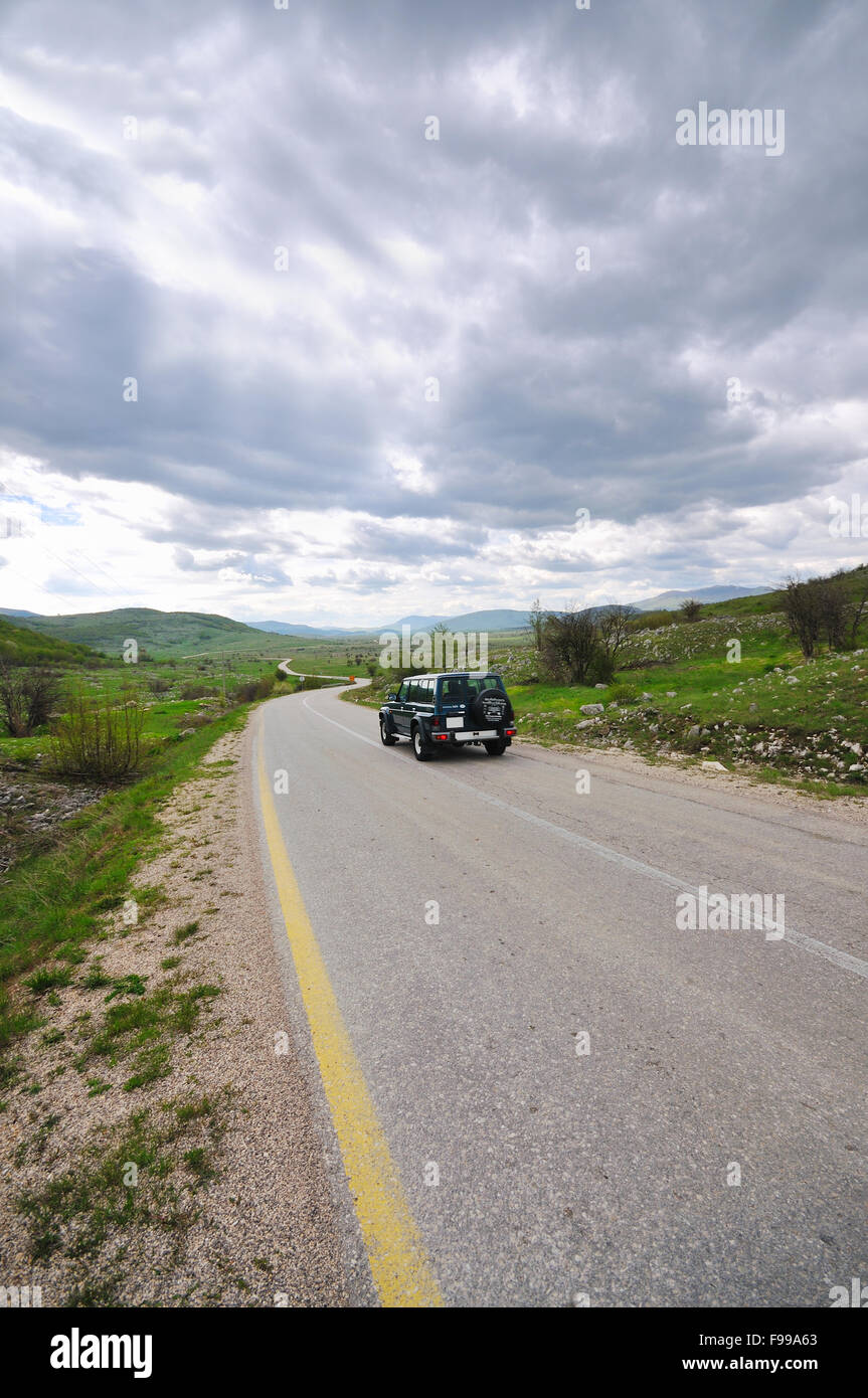 big truck drive on long country road Stock Photo - Alamy