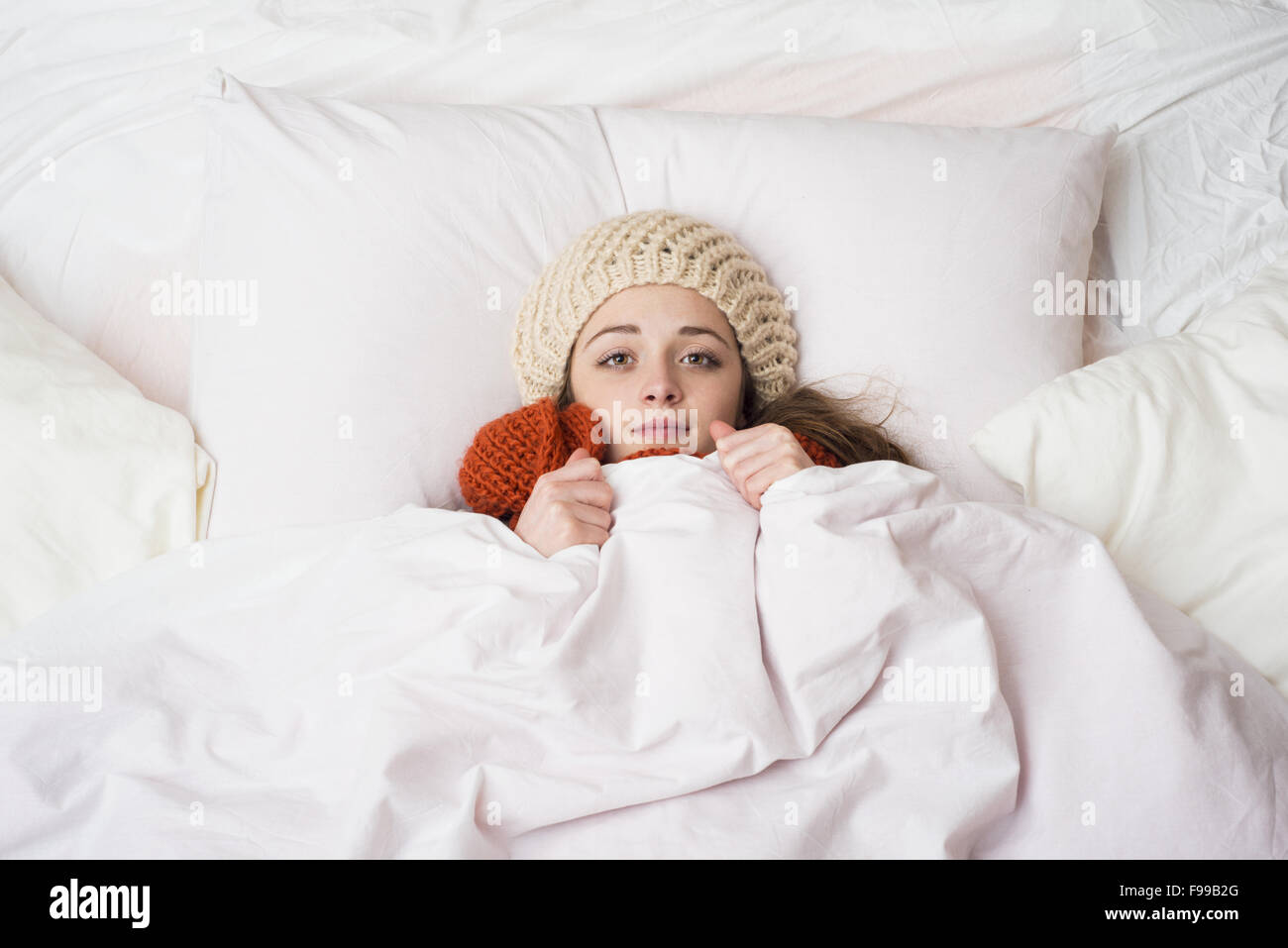 Sick Woman Lying In Bed With High Fever She Has Cold And Flu Stock