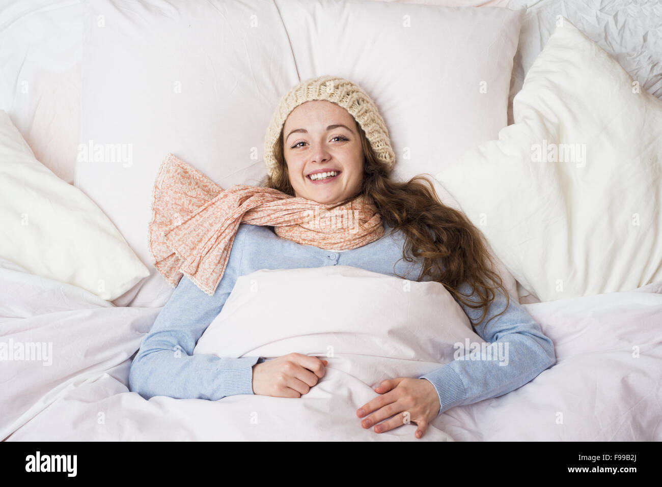 Sick woman lying in bed with high fever. She has cold and flu Stock ...