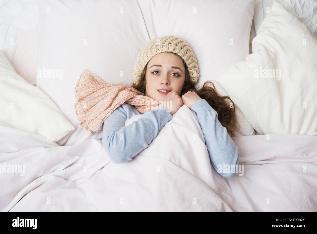 Sick woman lying in bed with high fever. She has cold and flu Stock ...
