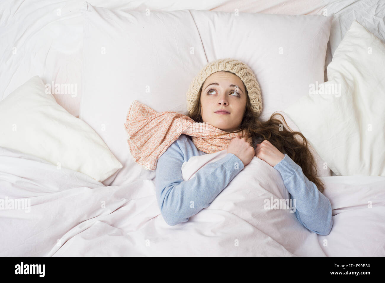 Sick woman lying in bed with high fever. She has cold and flu Stock ...