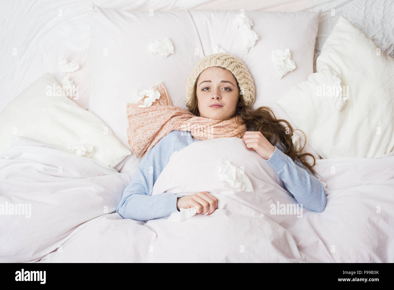 Sick woman lying in bed with high fever. She has cold and flu Stock ...