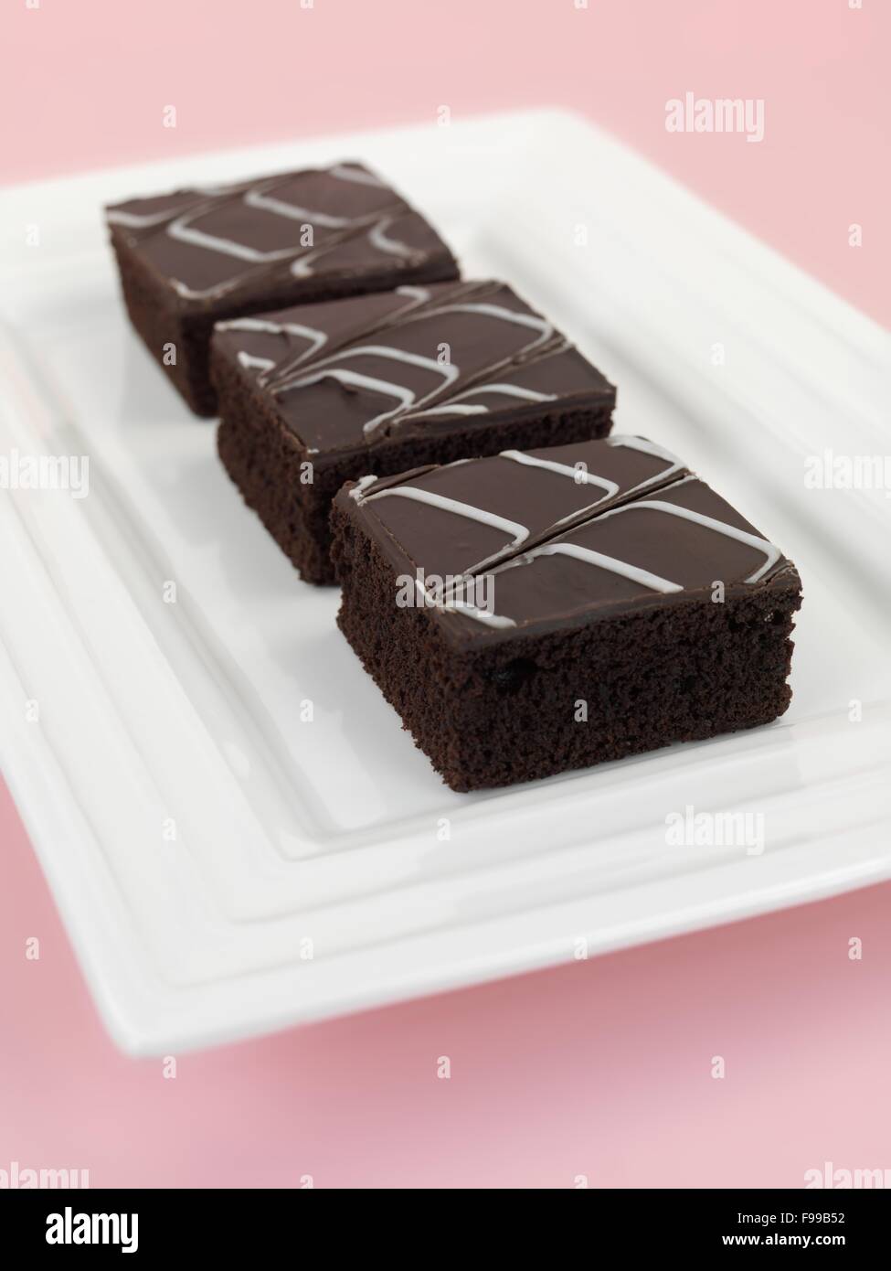 Chocolate Mud Cake Slices Stock Photo - Alamy