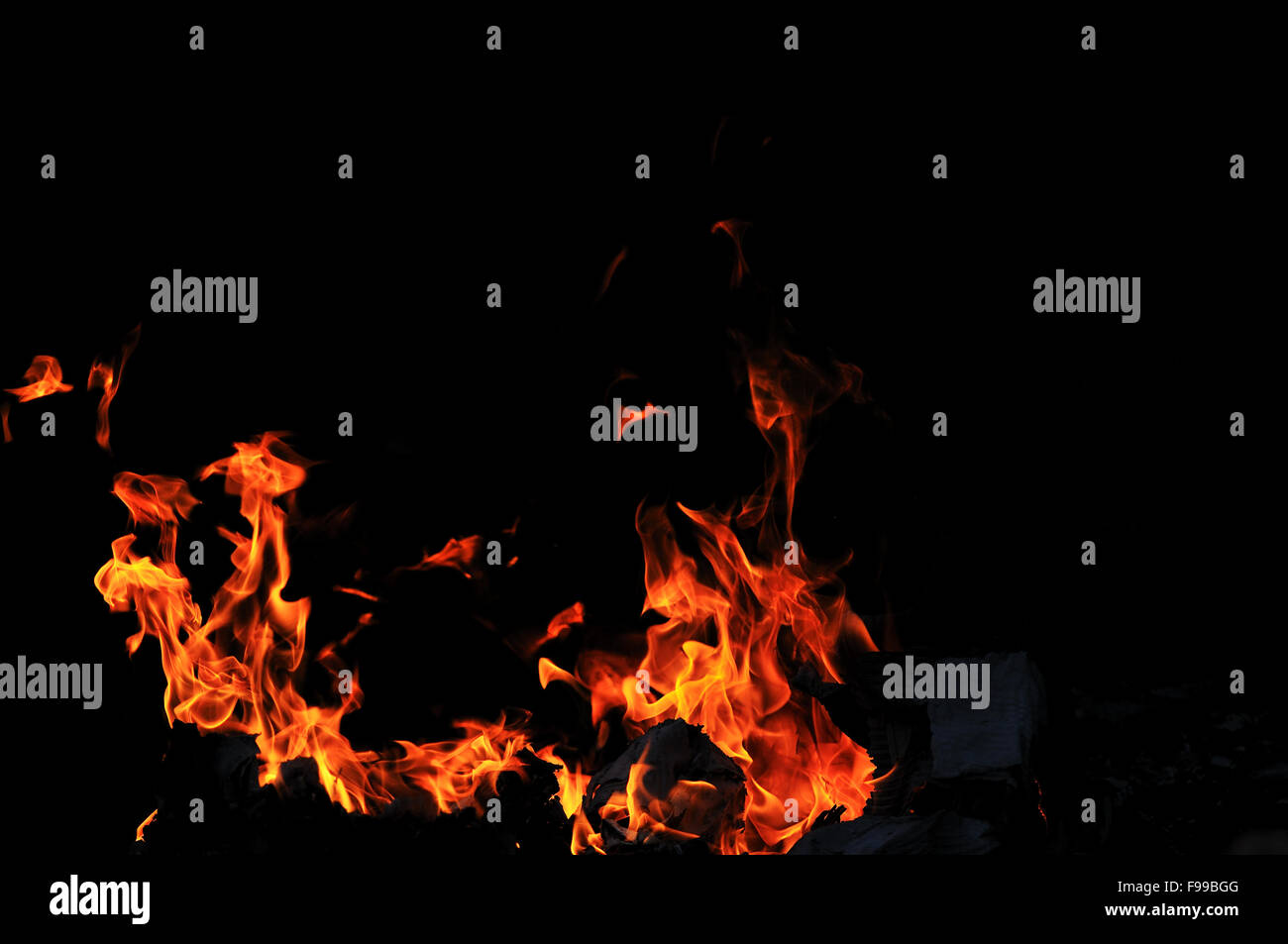 wild fire flames burn hot with black background Stock Photo - Alamy