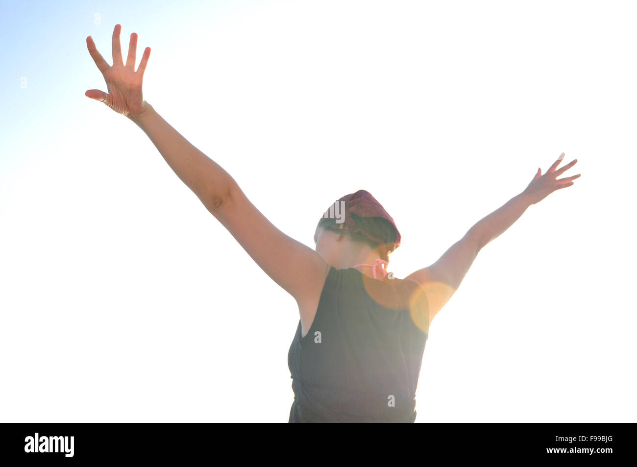 young happy woman with arms wide open representing freedom concept ...