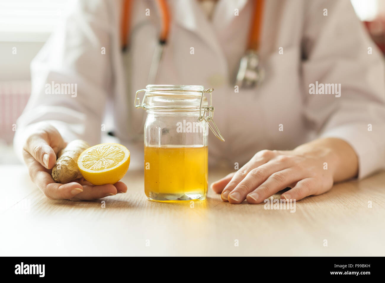 Detail of honey and lemon with doctor woman in background Stock Photo ...