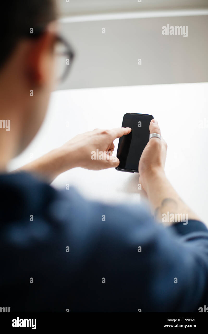 Young man with smartphone Stock Photo - Alamy
