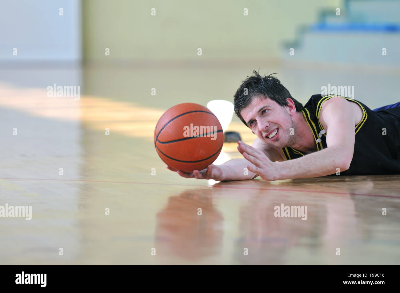 one healthy young man play basketball game in school gym indoor Stock ...
