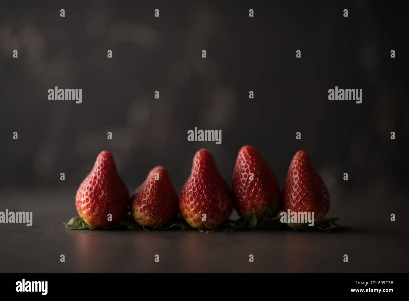 Strawberry on stone background Stock Photo - Alamy