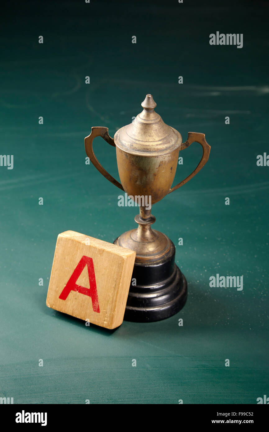 wood block with alphabet A and trophy on the blackboard Stock Photo - Alamy