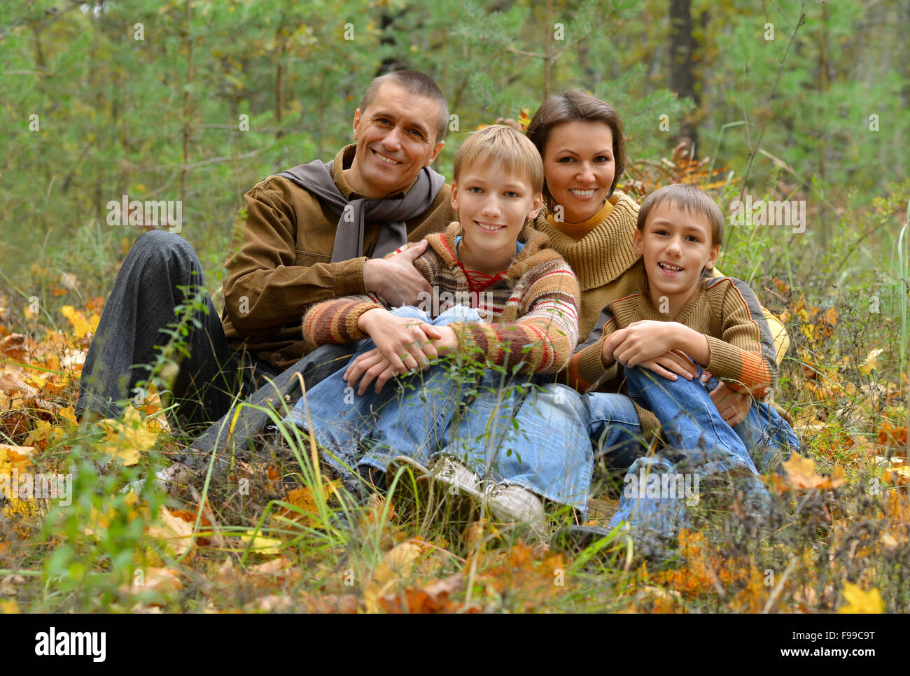 Portrait of family relaxing Stock Photo - Alamy