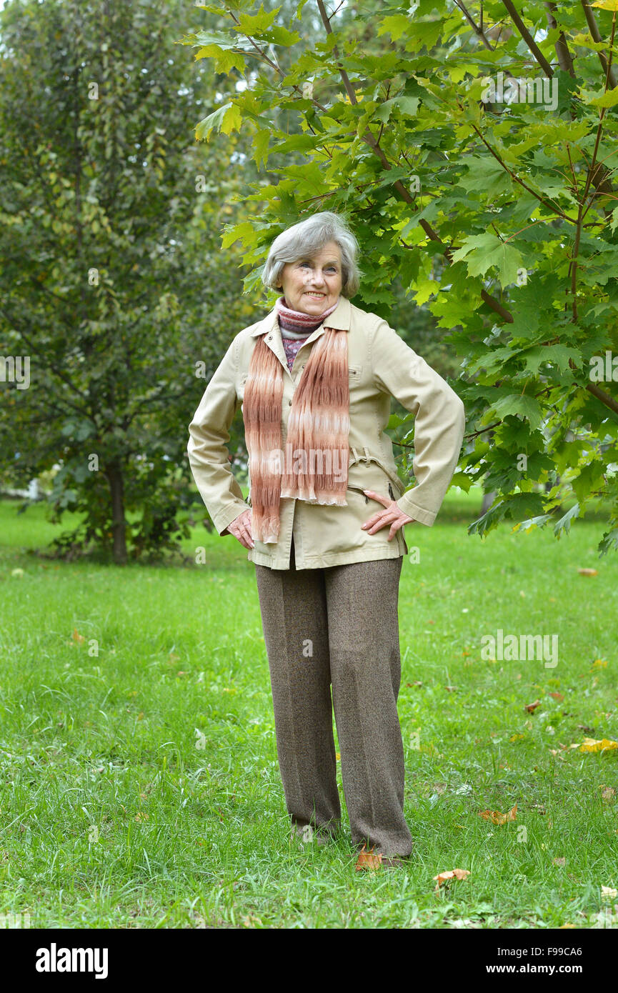 Senior woman walking Stock Photo - Alamy