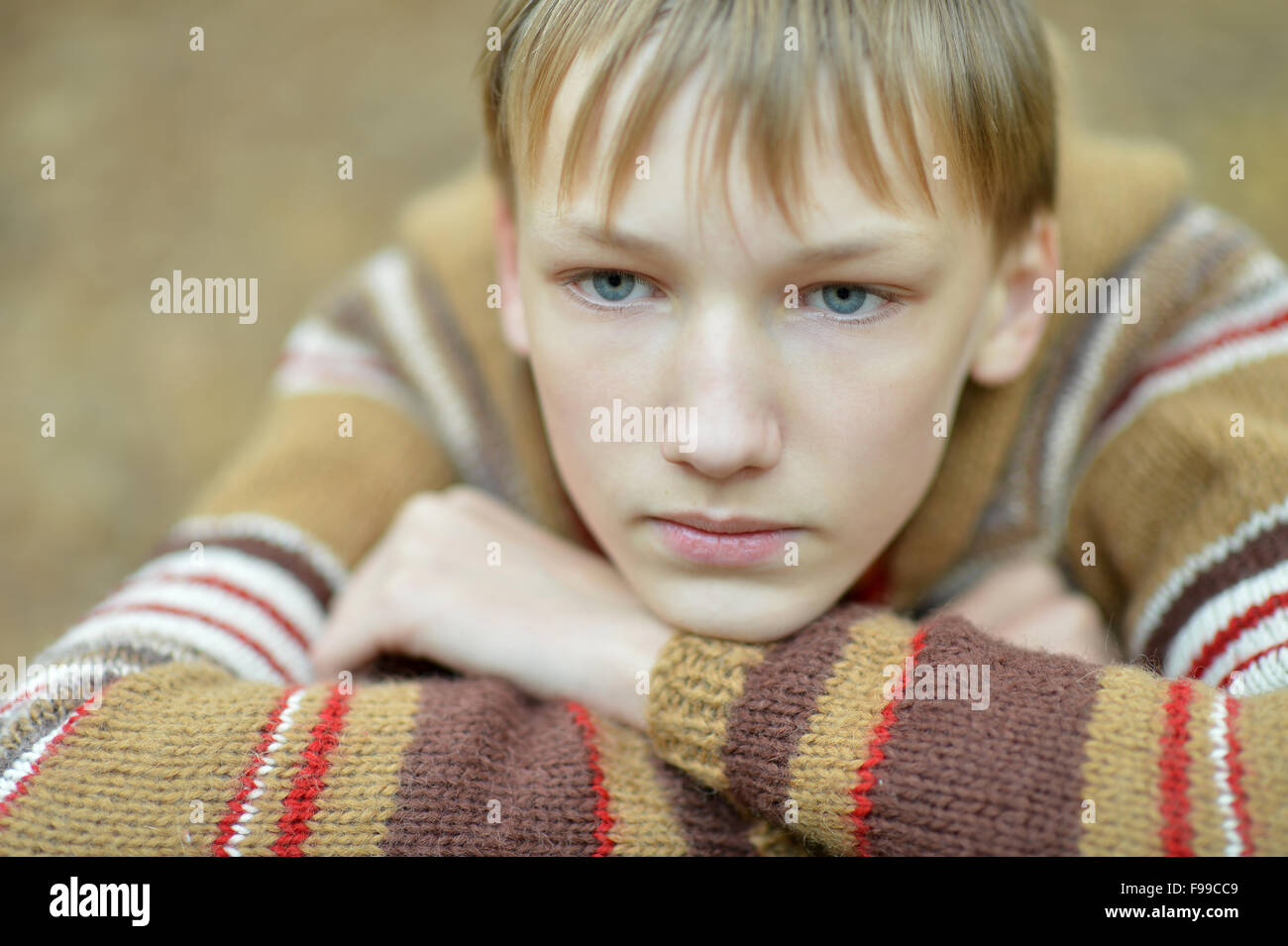Sad boy in autumn park hi-res stock photography and images - Alamy