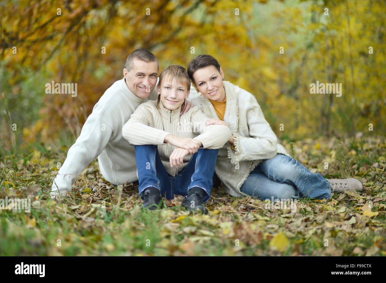 happy family in autumn park Stock Photo - Alamy