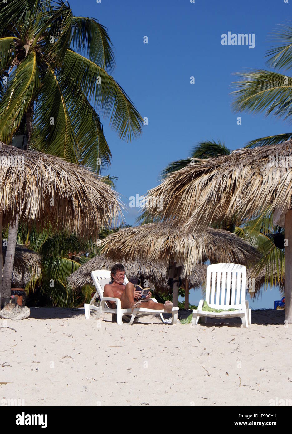 Relaxing on Playa Ancon beach, Trinidad, Cuba Stock Photo - Alamy