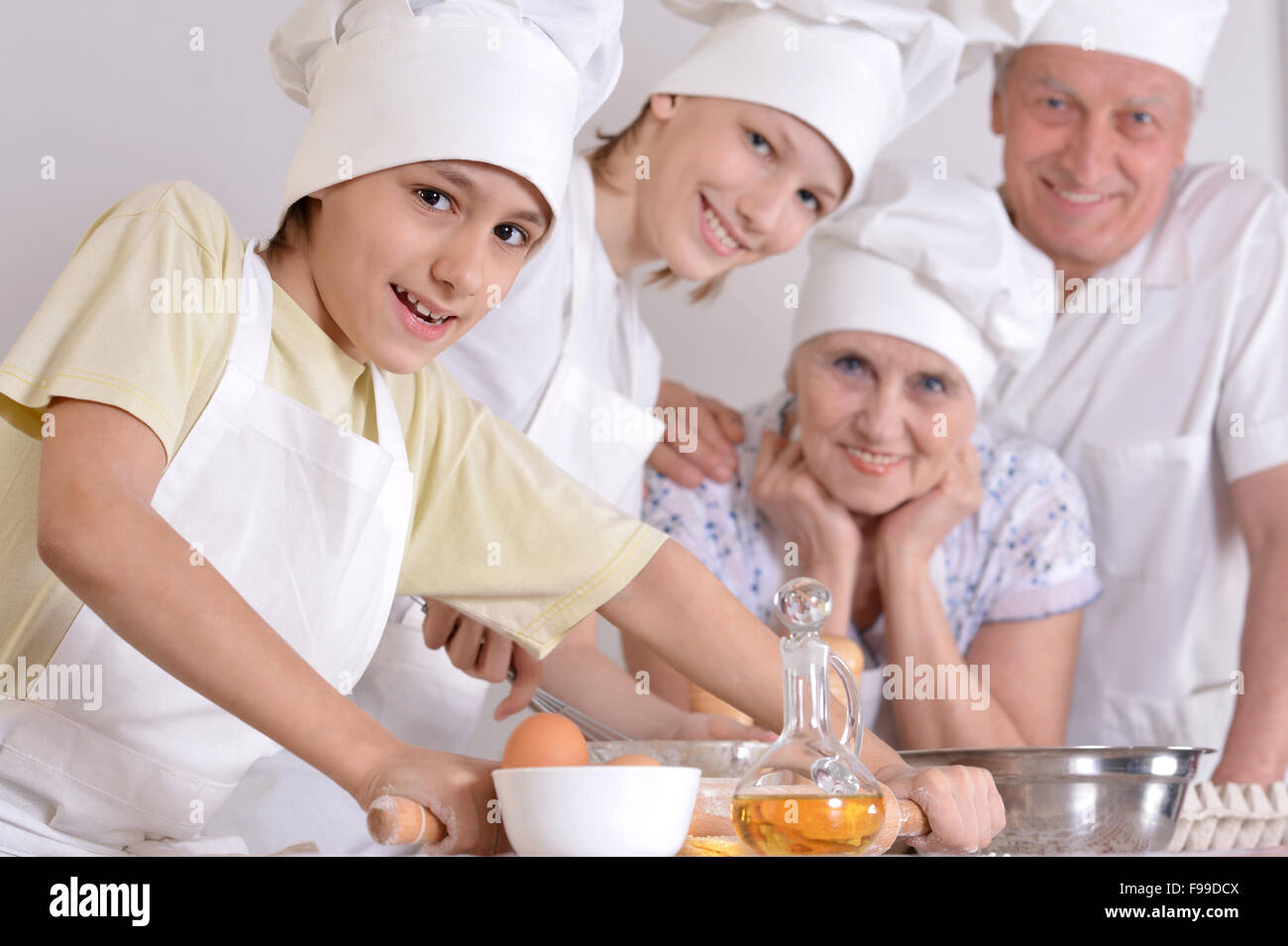 Happy family cooking together Stock Photo - Alamy
