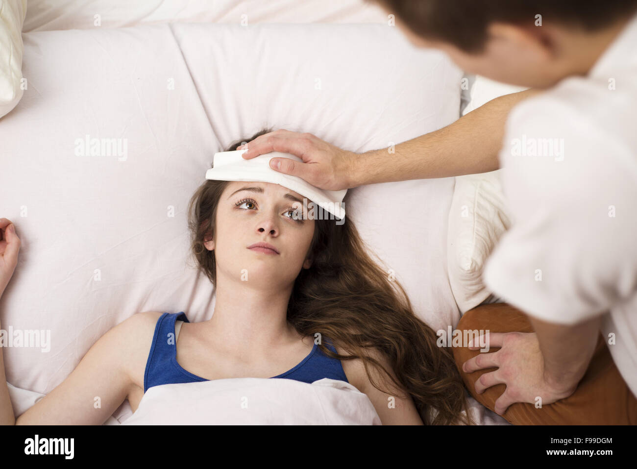 Sick Woman Is Lying In Bed She Has Cold Flu And High Fever Stock