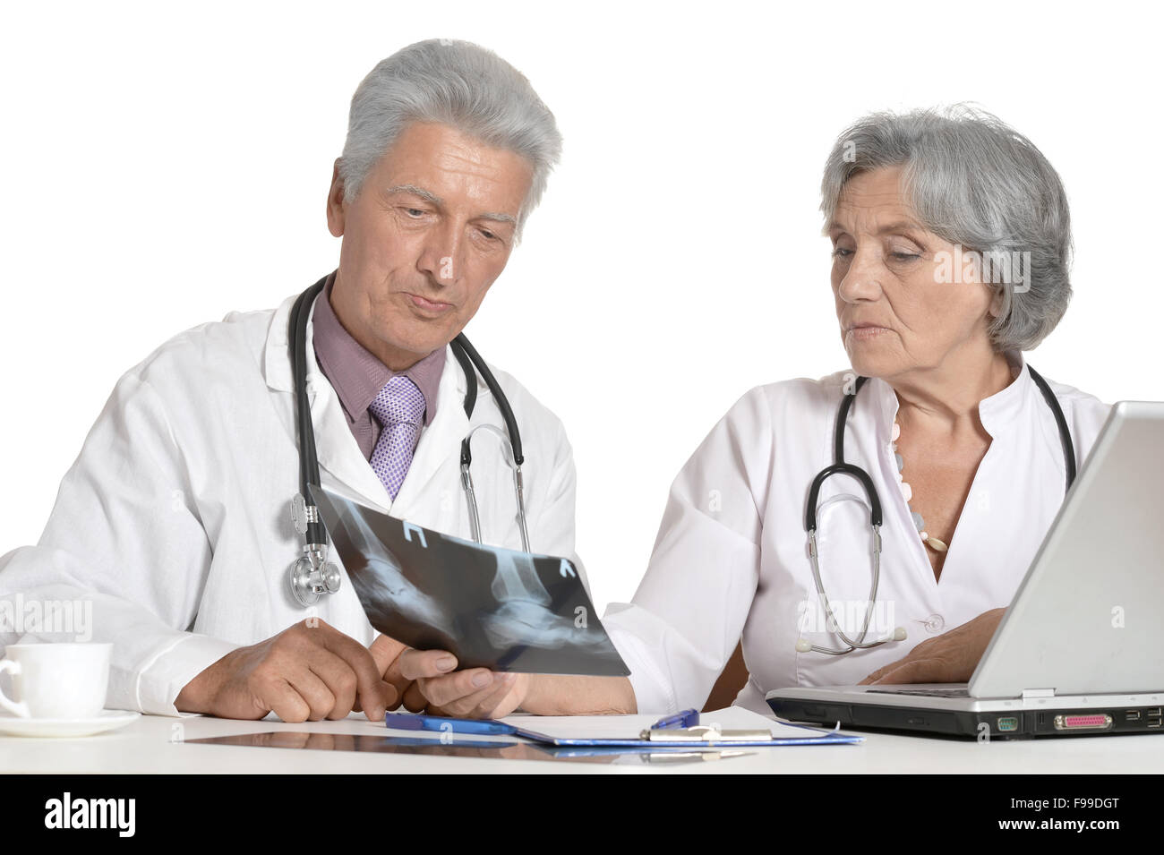 Doctors with stethoscopes looking at x-ray Stock Photo - Alamy