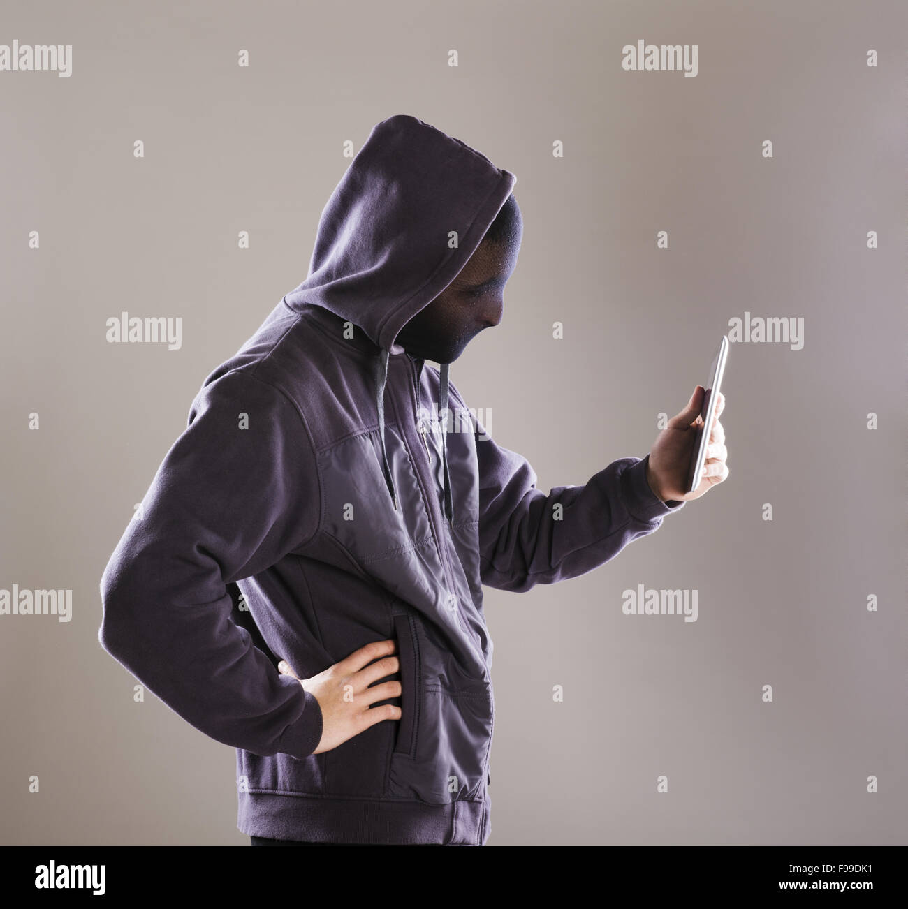 Dangerous man in mask with tablet on isolated background Stock Photo ...