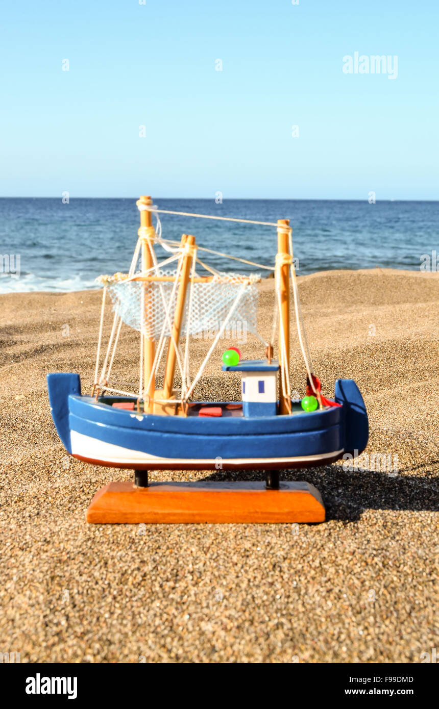 Toy Boat on the Sand Beach Stock Photo - Alamy
