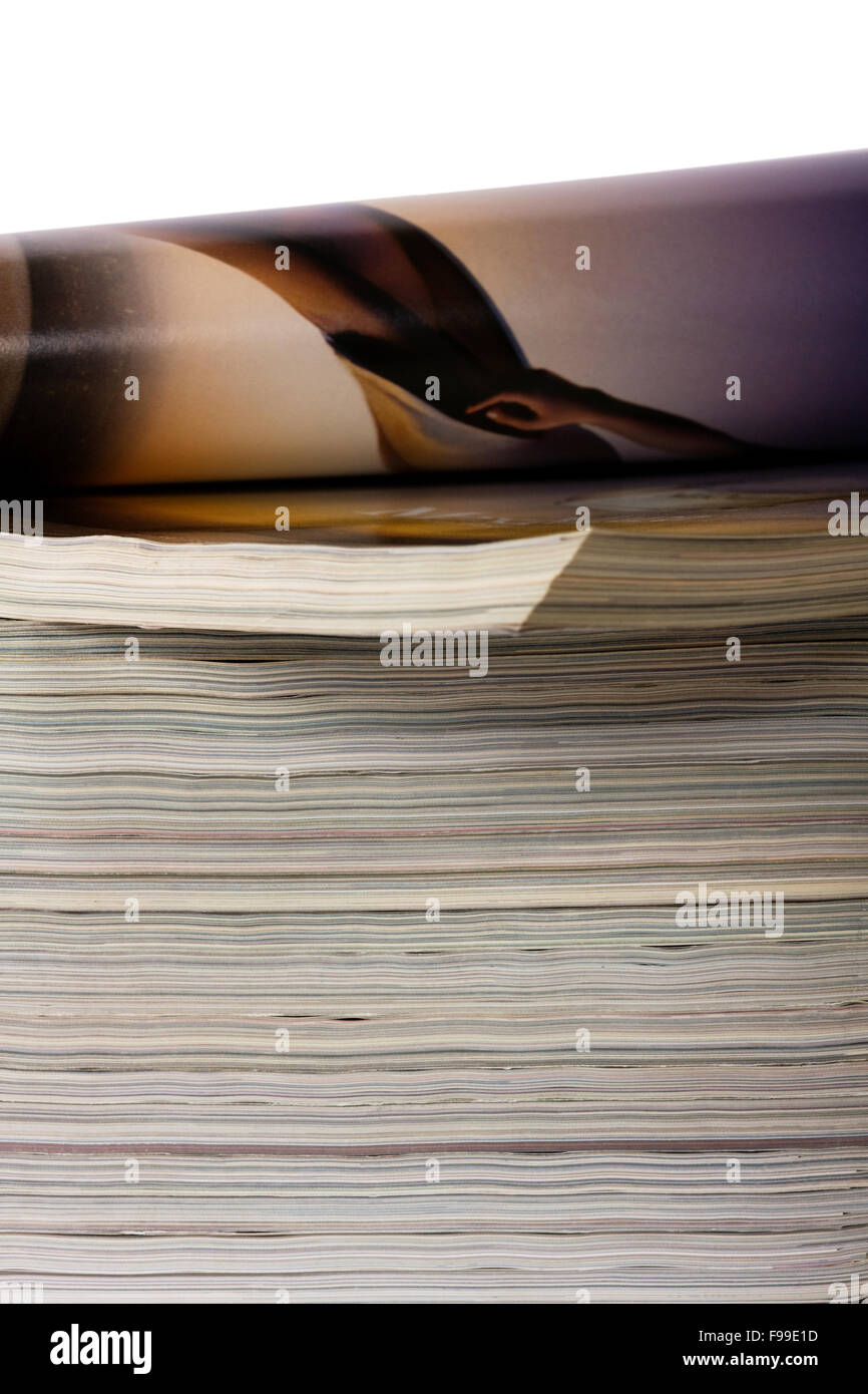 A stack of magazines isolated on white background Stock Photo - Alamy