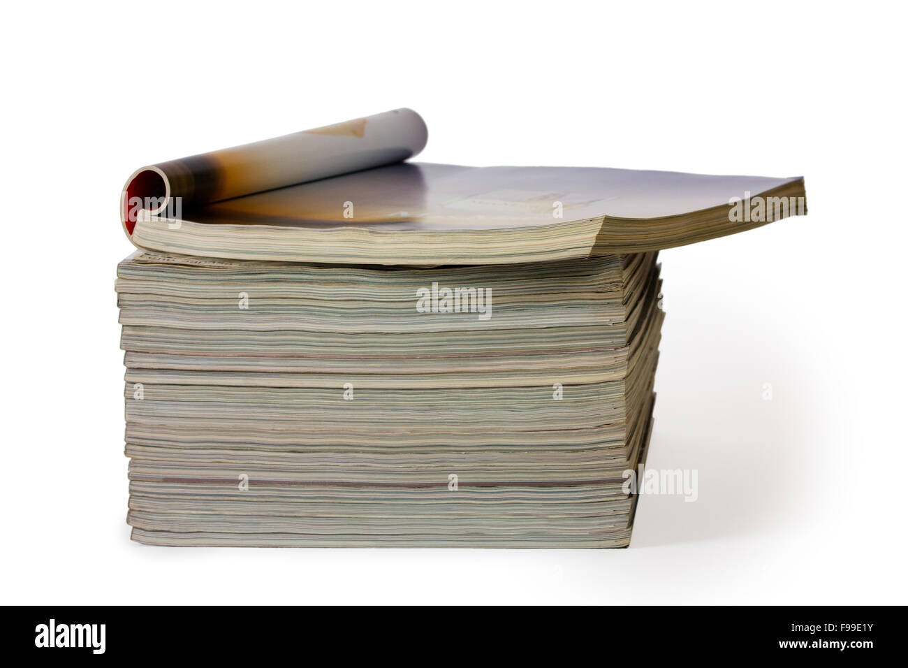 A stack of magazines isolated on white background Stock Photo - Alamy