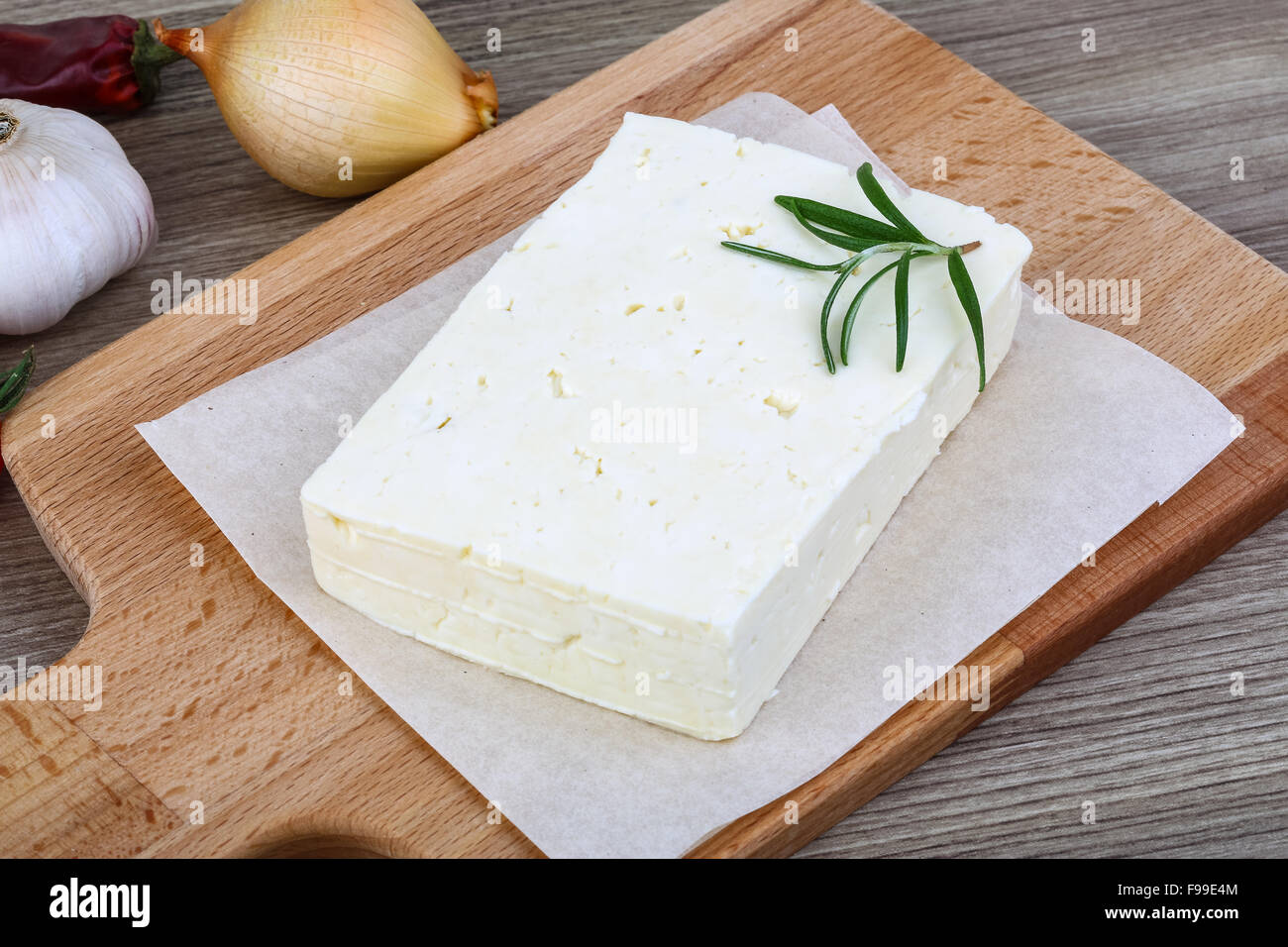 Traditional Caucasian homemade Cheese Brinza with rosemary on wood ...
