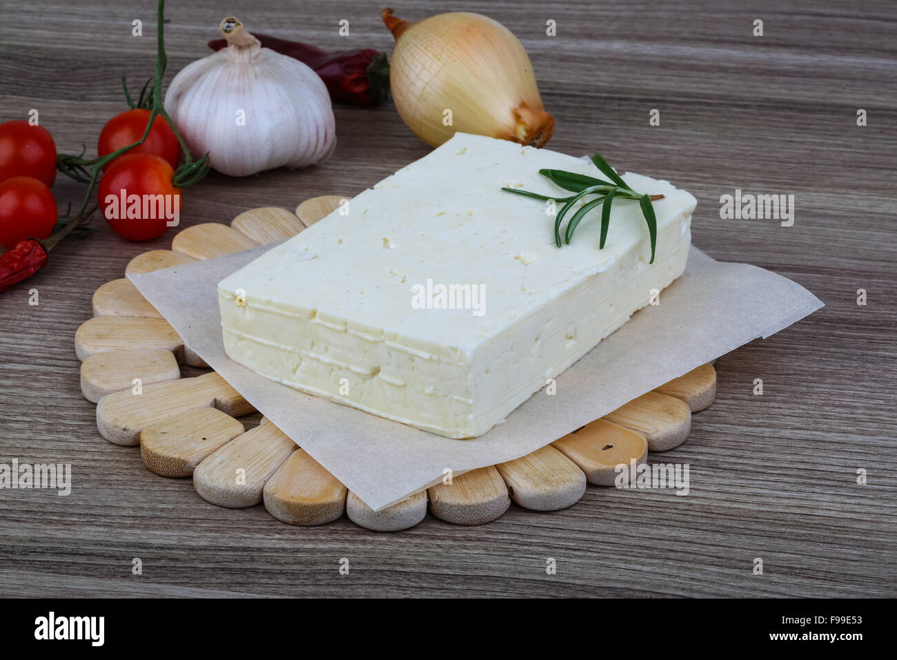 Traditional Caucasian homemade Cheese Brinza with rosemary on wood ...
