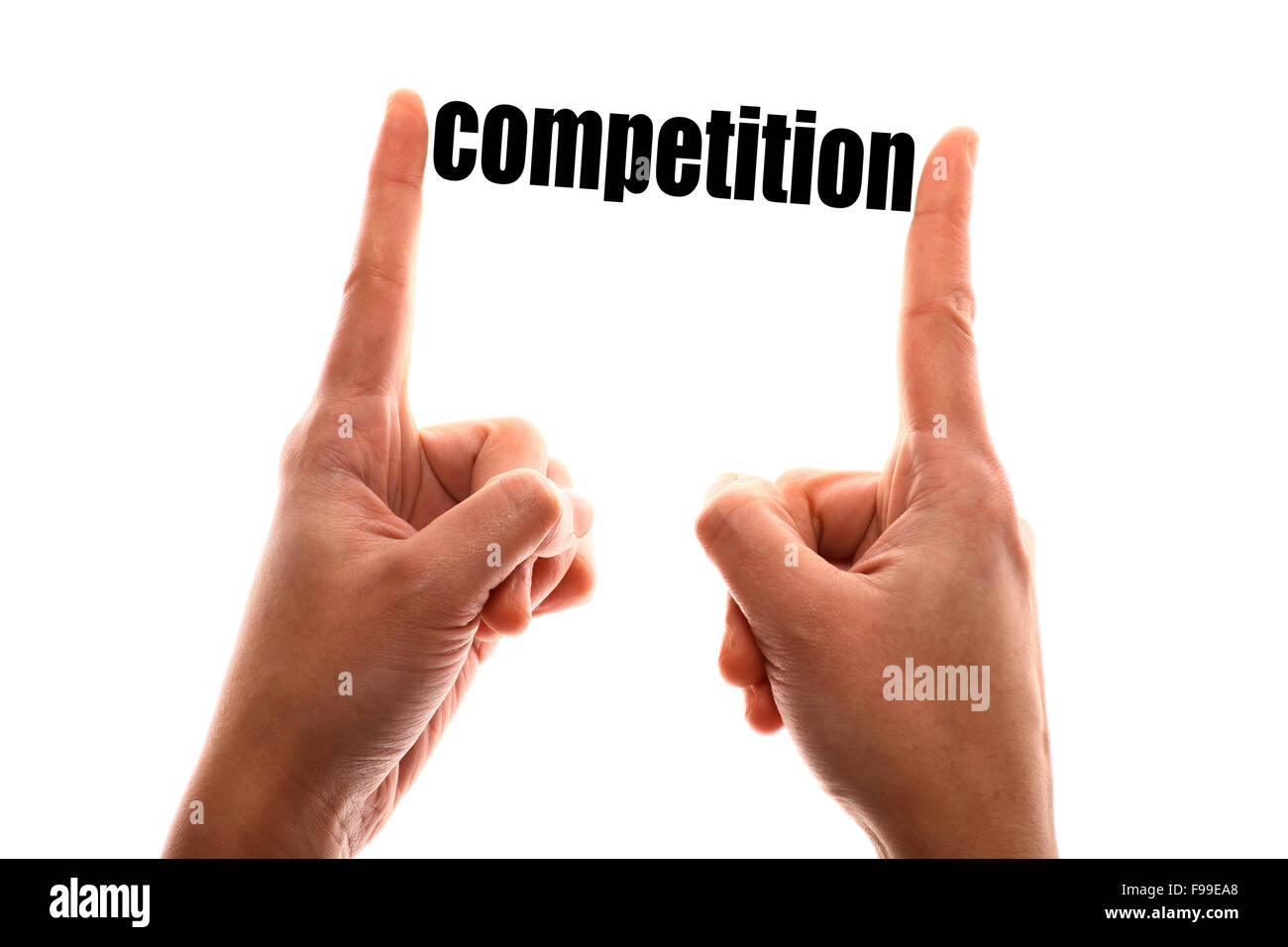 Color horizontal shot of a of a hand squeezing the word "competition ...