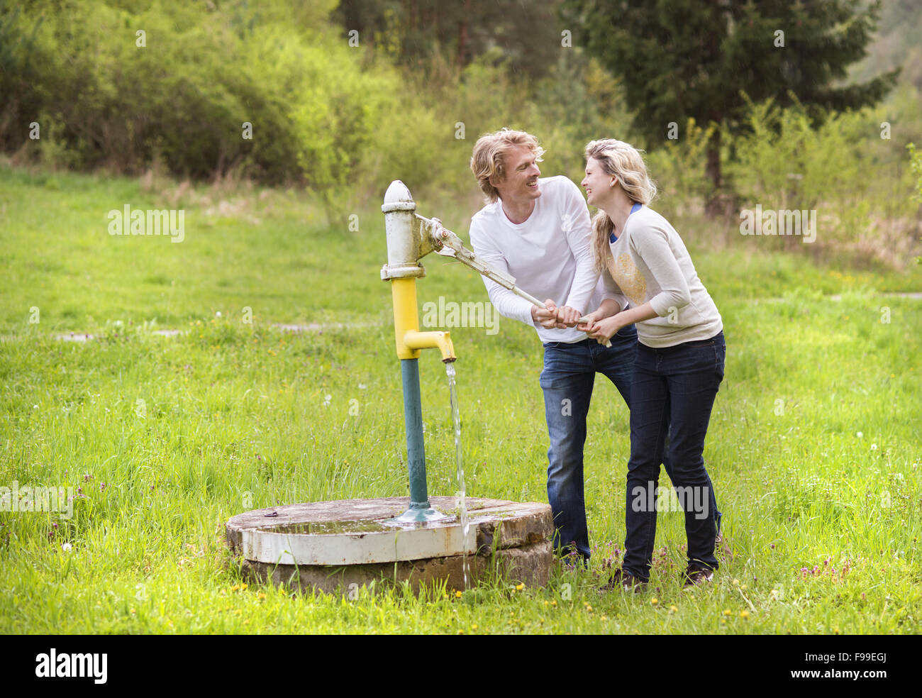Girl pumping water hi-res stock photography and images - Alamy