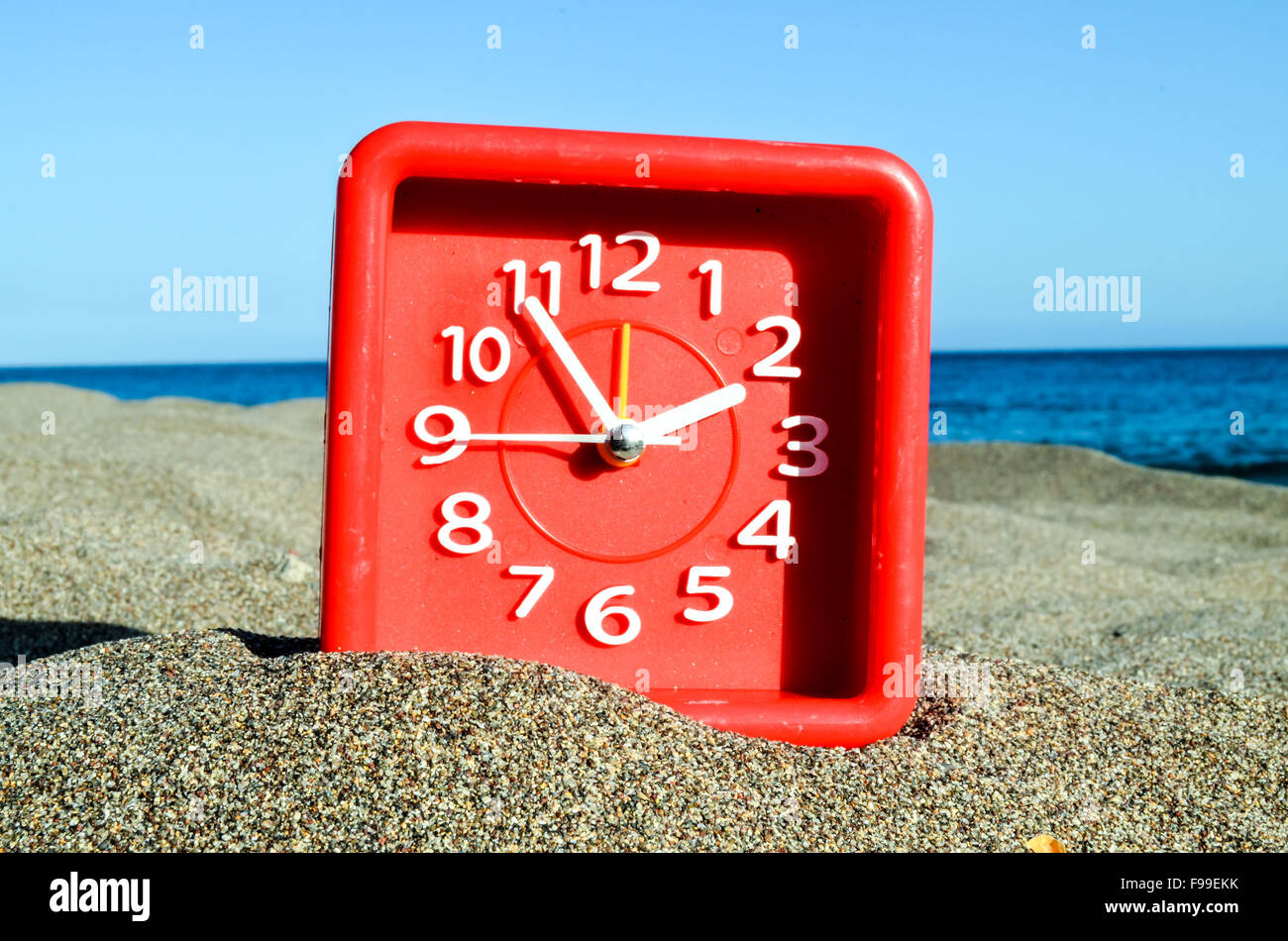Clock on the Sand Beach Stock Photo - Alamy