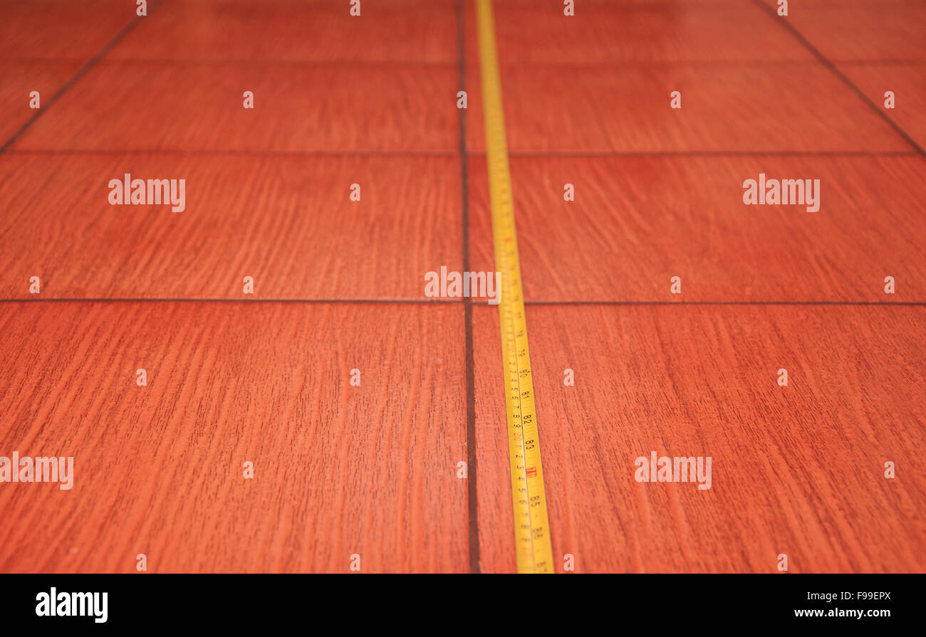 Tile for floor with ruler Stock Photo - Alamy