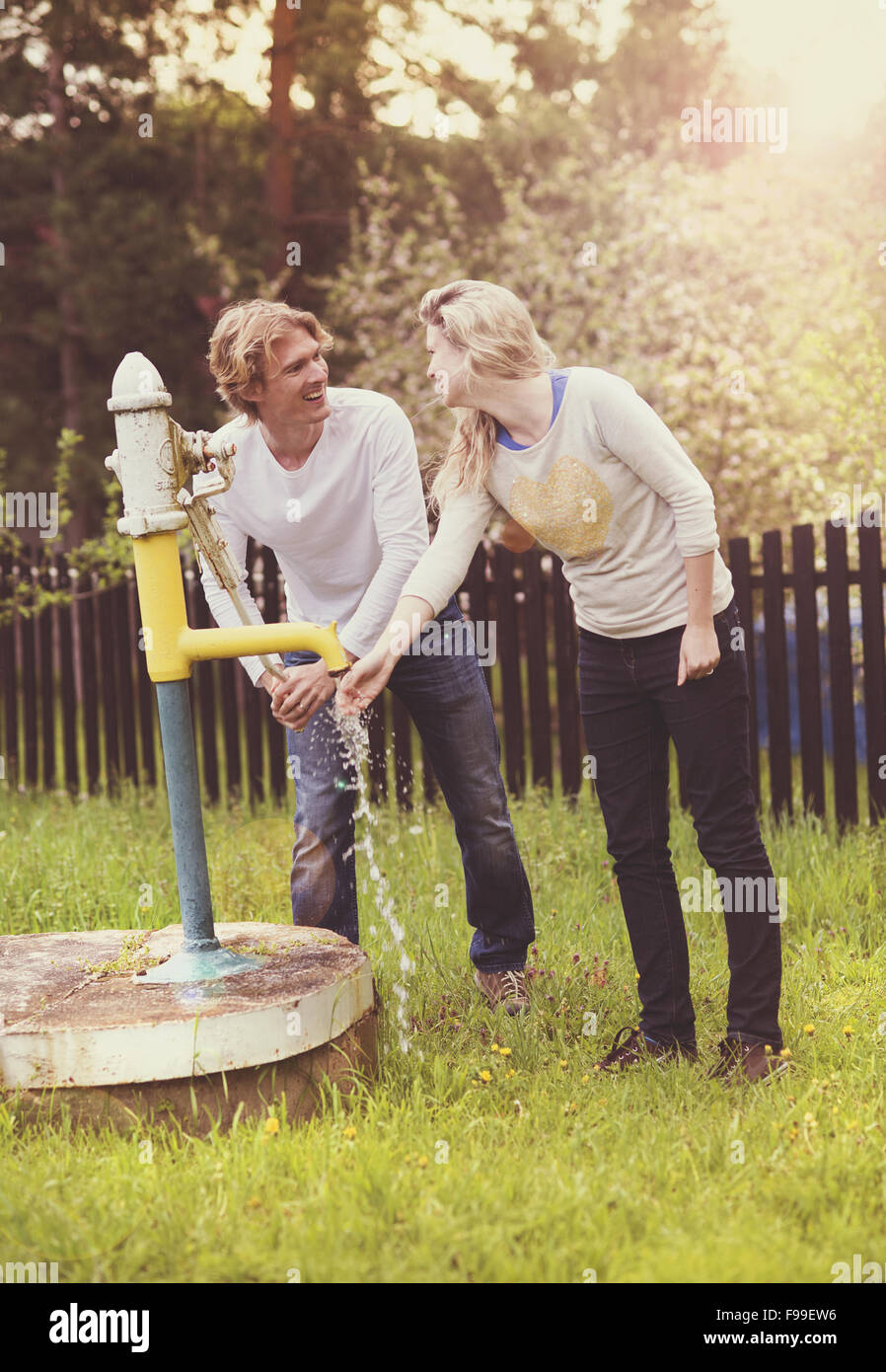Girl pumping water hi-res stock photography and images - Alamy