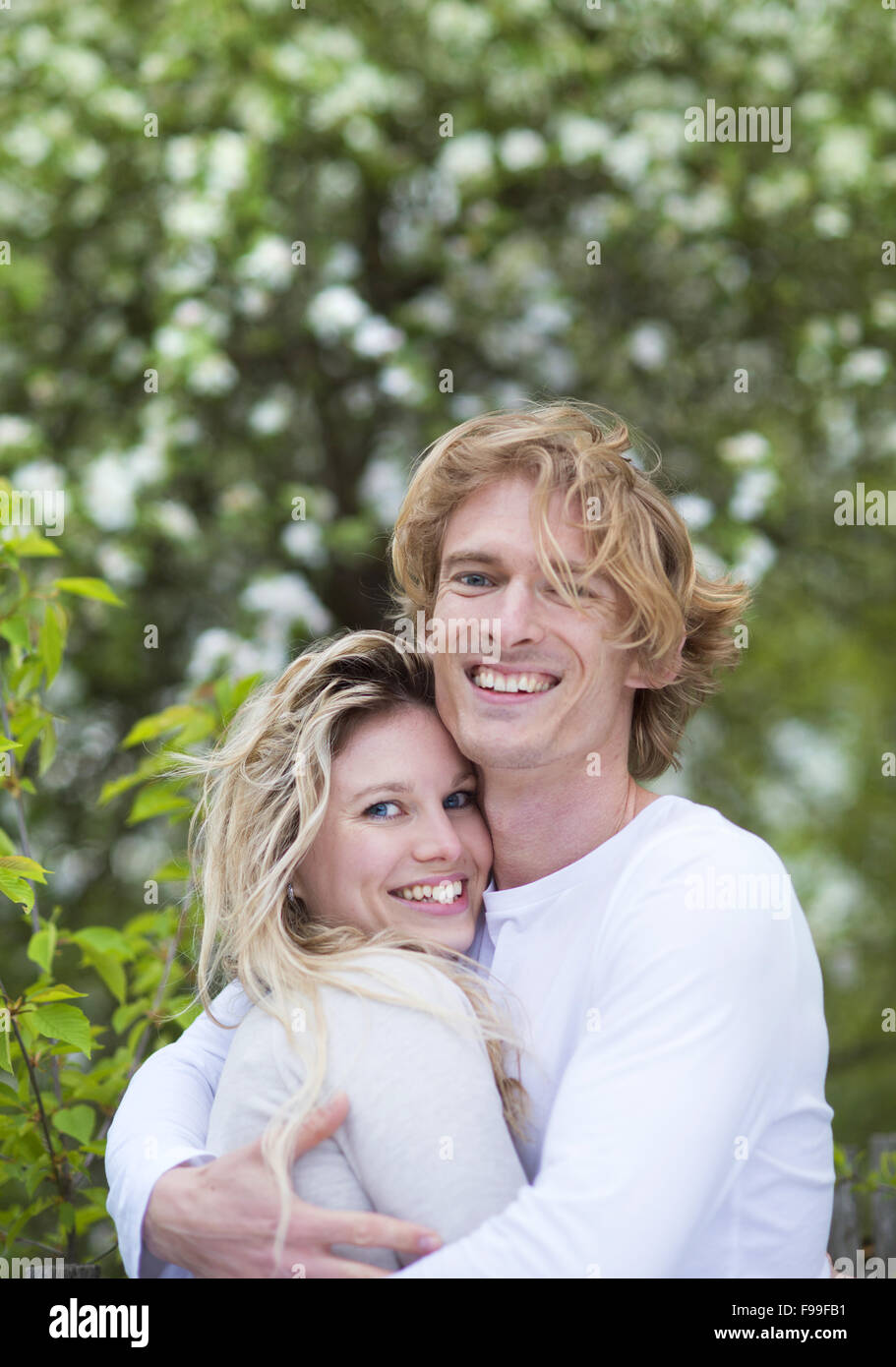 Happy young couple flirting park summer hi-res stock photography and ...