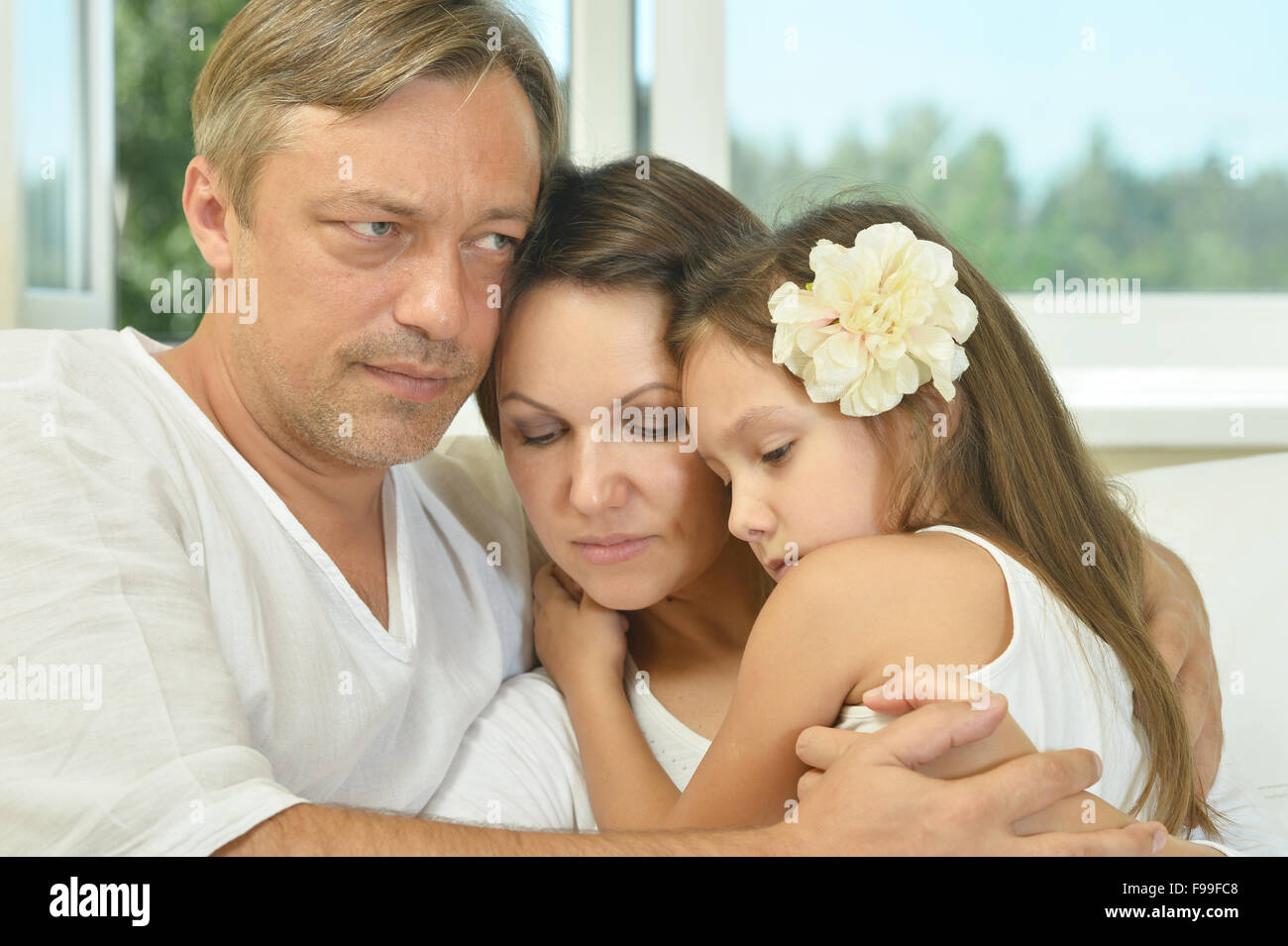 sad family with girl Stock Photo - Alamy