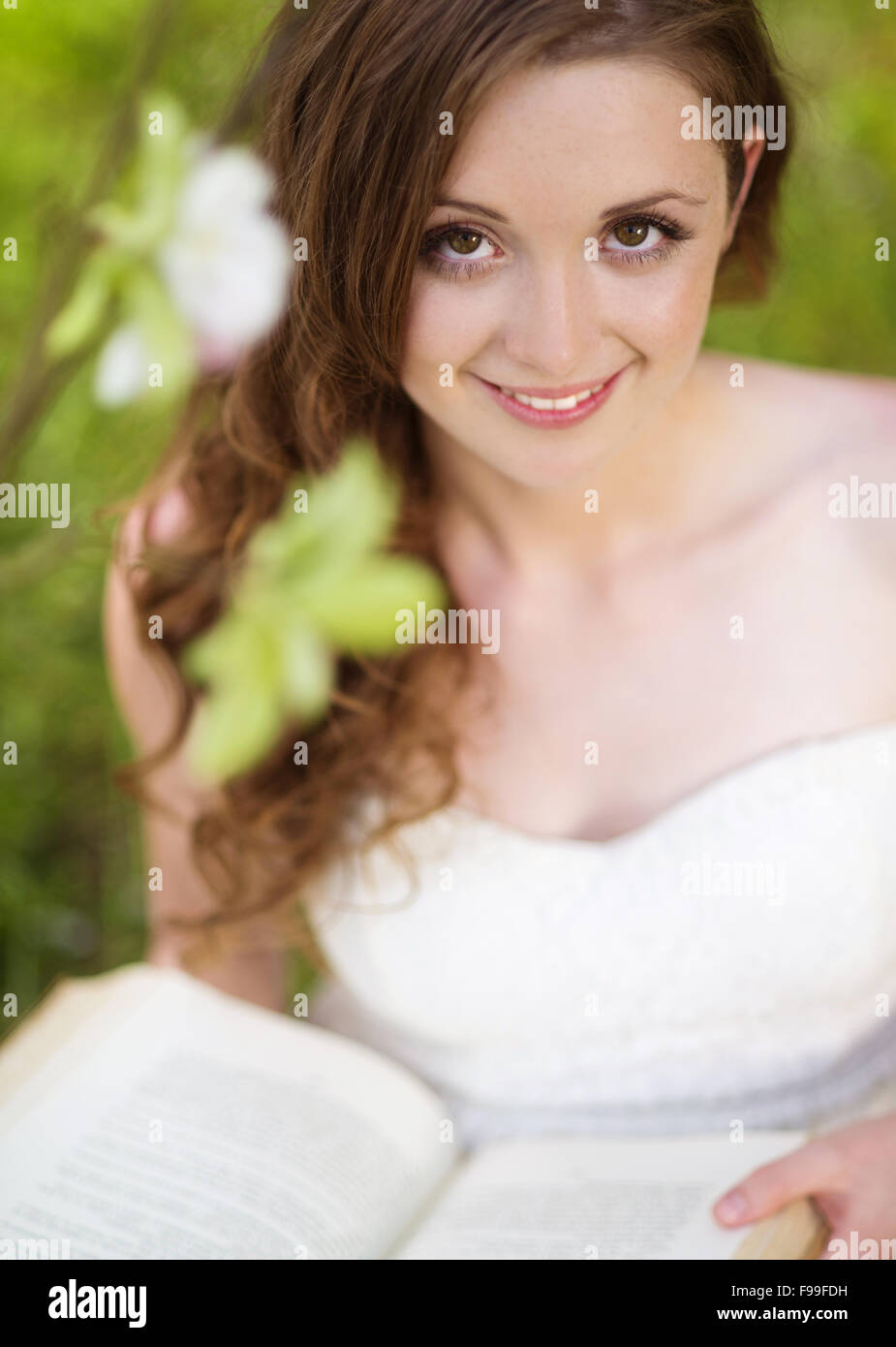 Beautiful woman with flowers in spring sunshine Stock Photo - Alamy