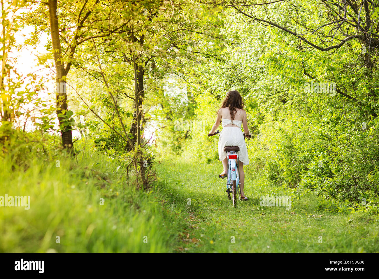 Pretty girl bike in park hi-res stock photography and images - Alamy