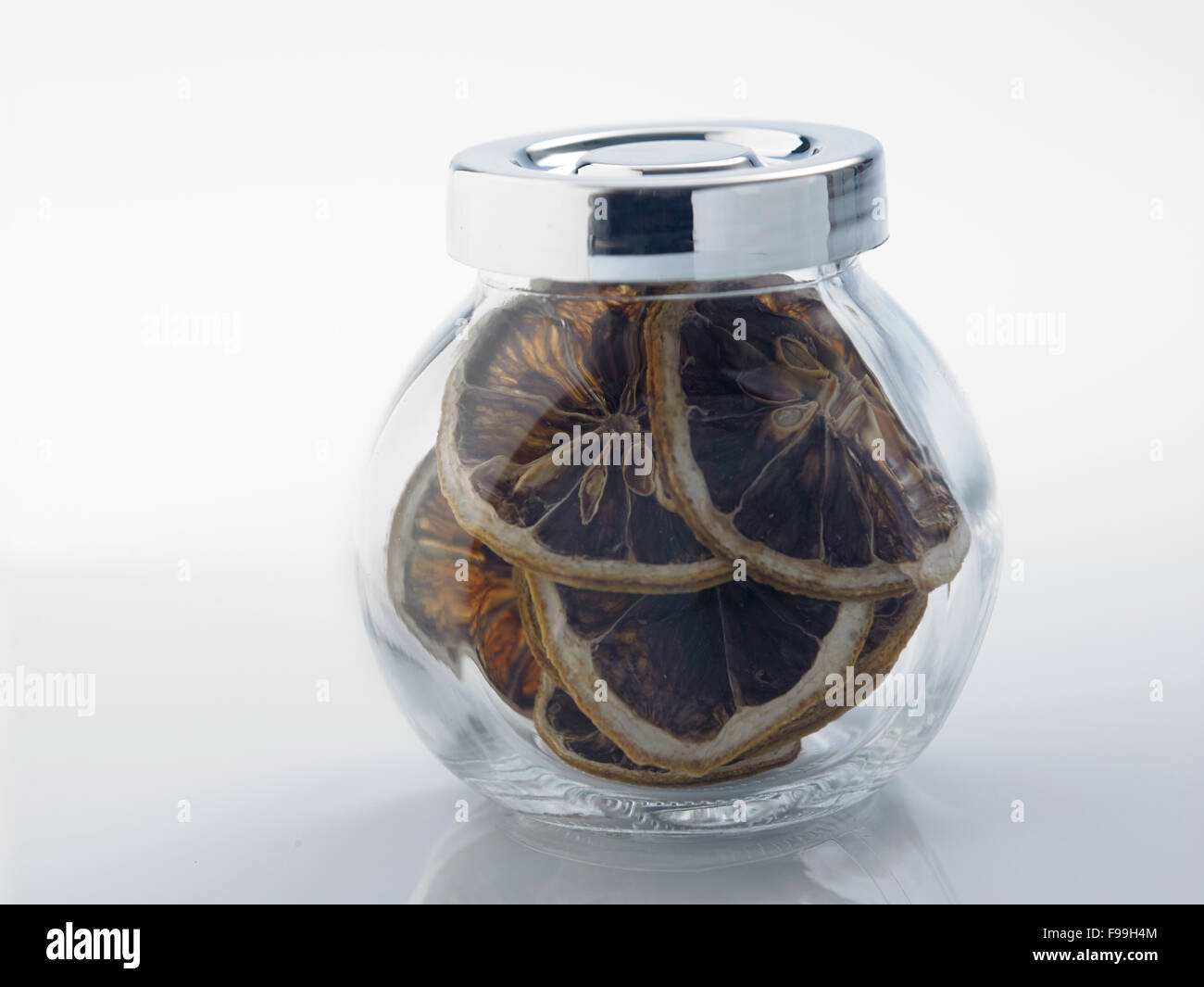 dried lemon slice in the glass container Stock Photo - Alamy