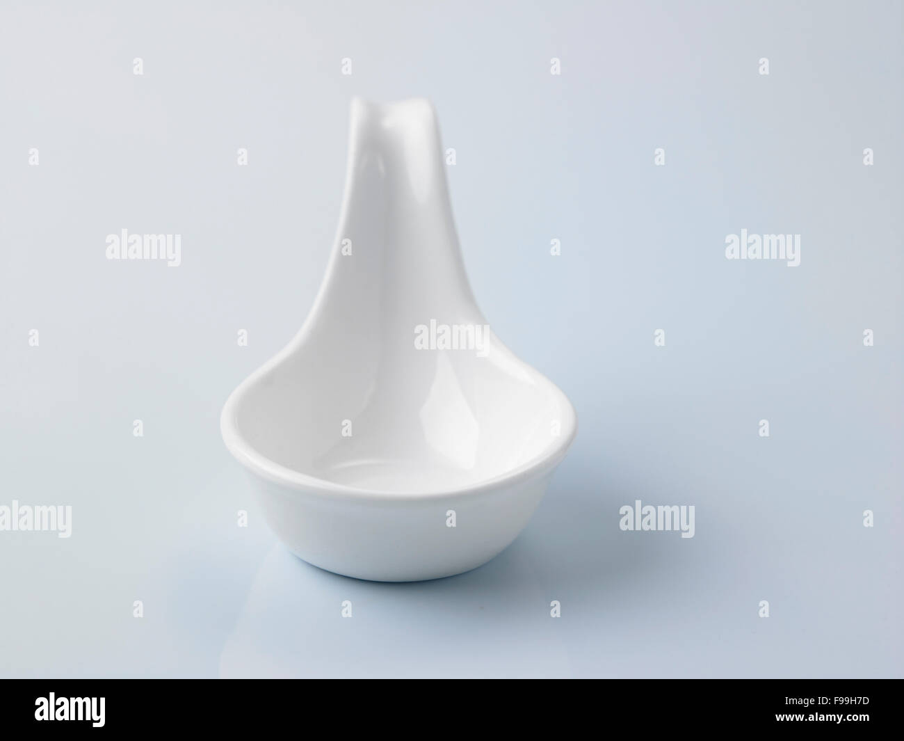 white saucer disgn like a spoon Stock Photo - Alamy