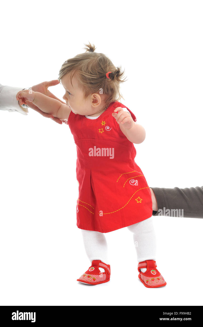 parent help and support baby to make first step isolated on white Stock ...