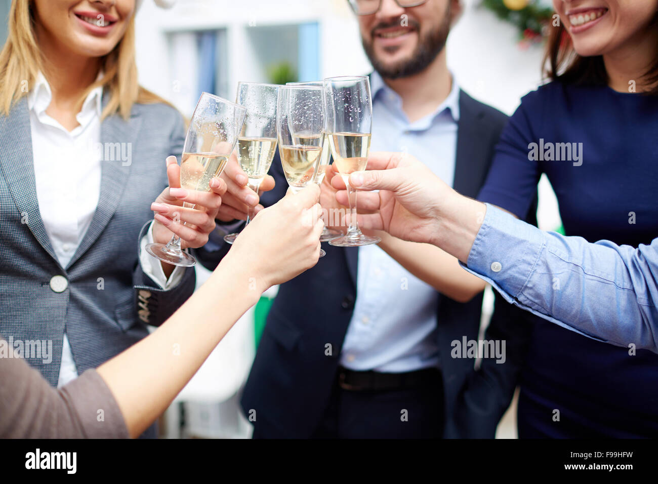 Group of colleagues toasting with champagne Stock Photo - Alamy