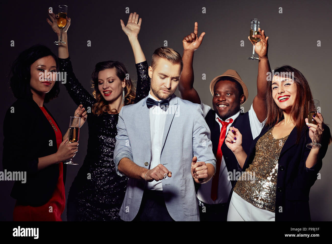 Smart clubbers with champagne having night party Stock Photo - Alamy