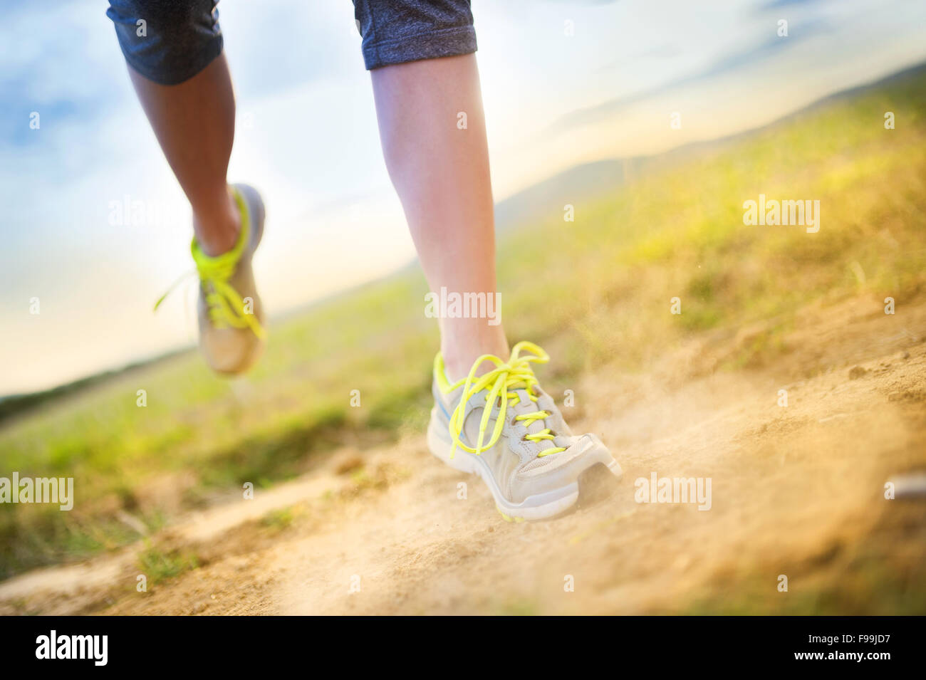 Runner woman feet running on countryside road, closeup on shoe Stock ...